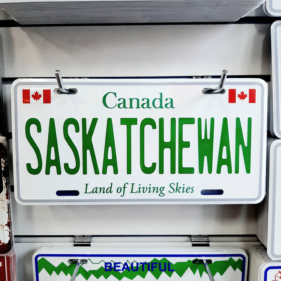 Saskatchewan Canada Tin License Plate – OGOPOGO GIFTLAND KELOWNA